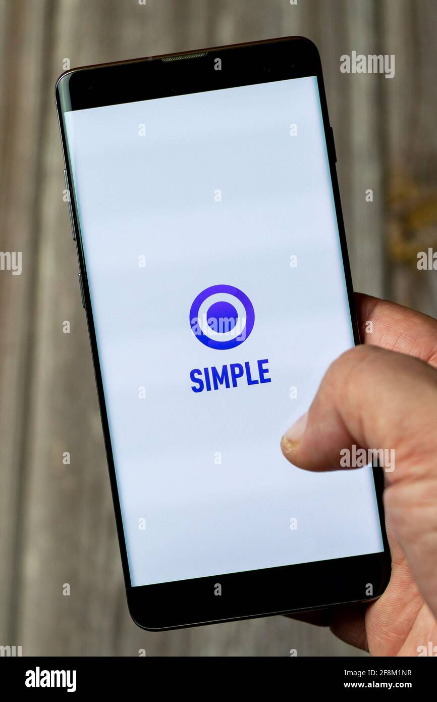 A Mobile phone or Cell phone being held in a hand showing the Simple ...