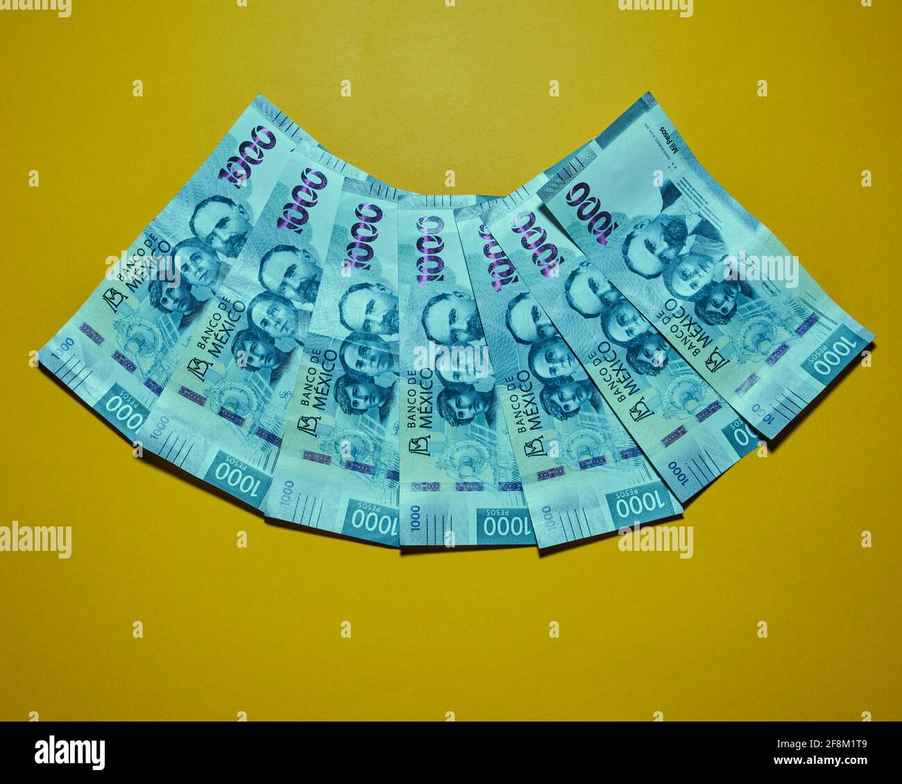 Top view of Mexican 1000 banknotes isolated on yellow background Stock ...