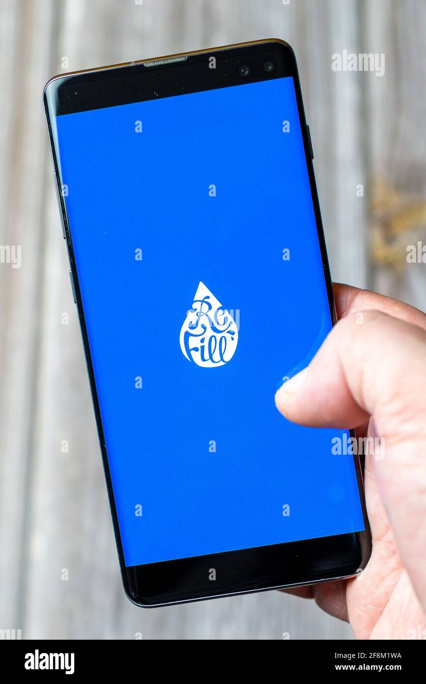 A Mobile phone or Cell phone being held in a hand showing the Refill ...