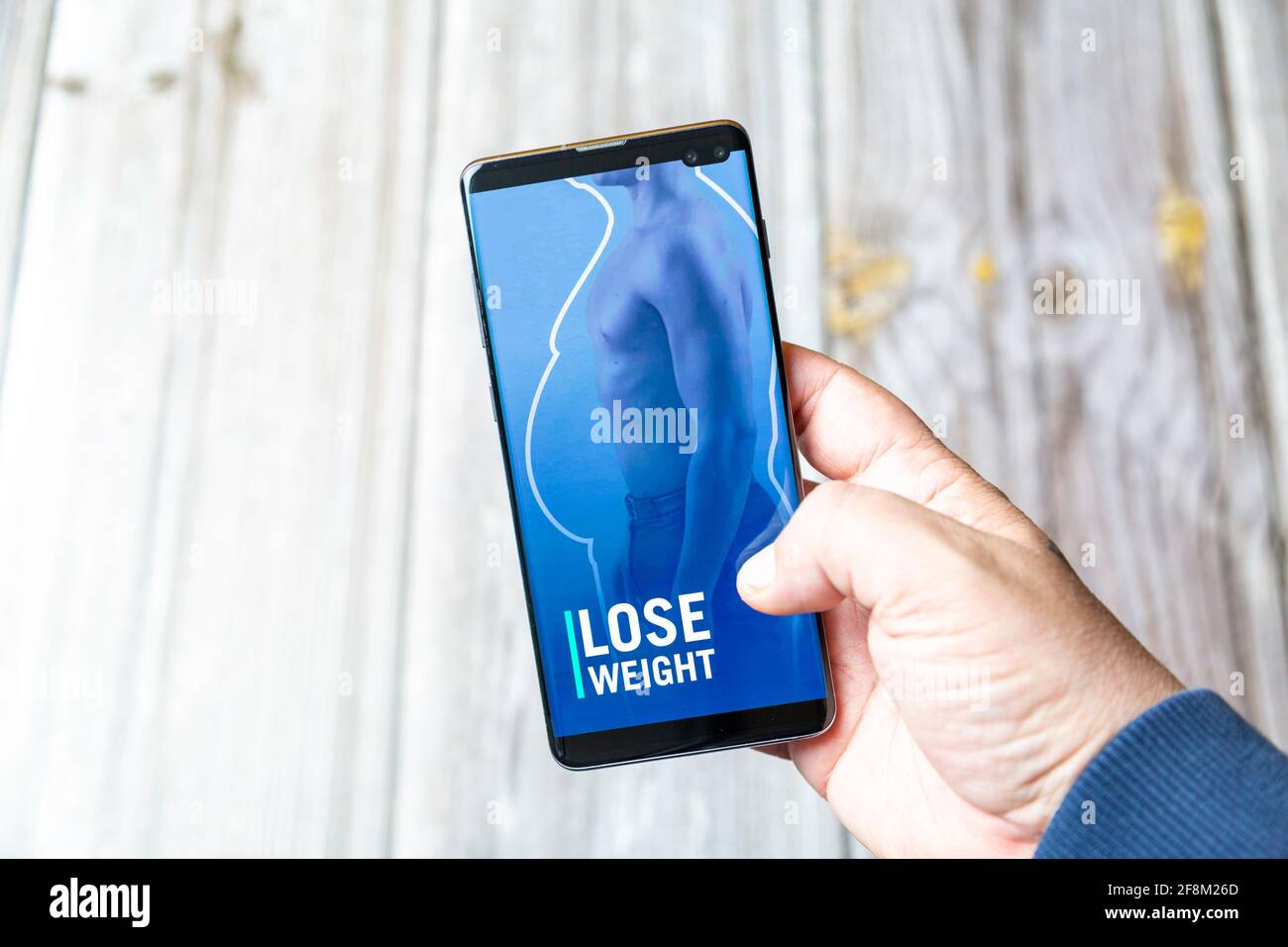 A Mobile phone or Cell phone being held in a hand showing the Lose ...