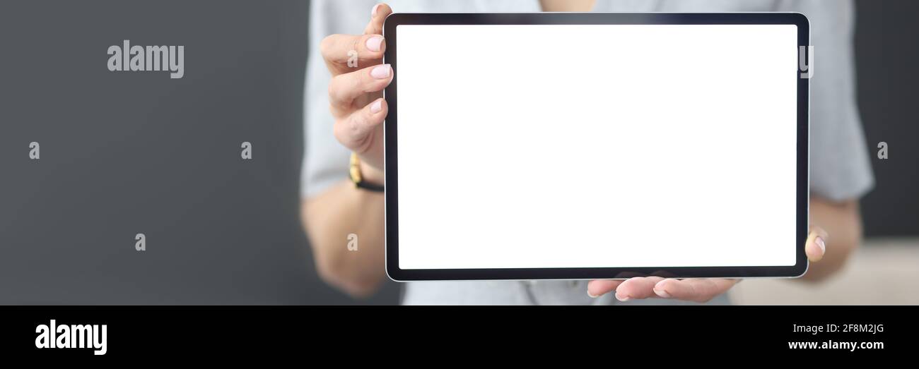 Female hands hold tablet with white screen Stock Photo - Alamy