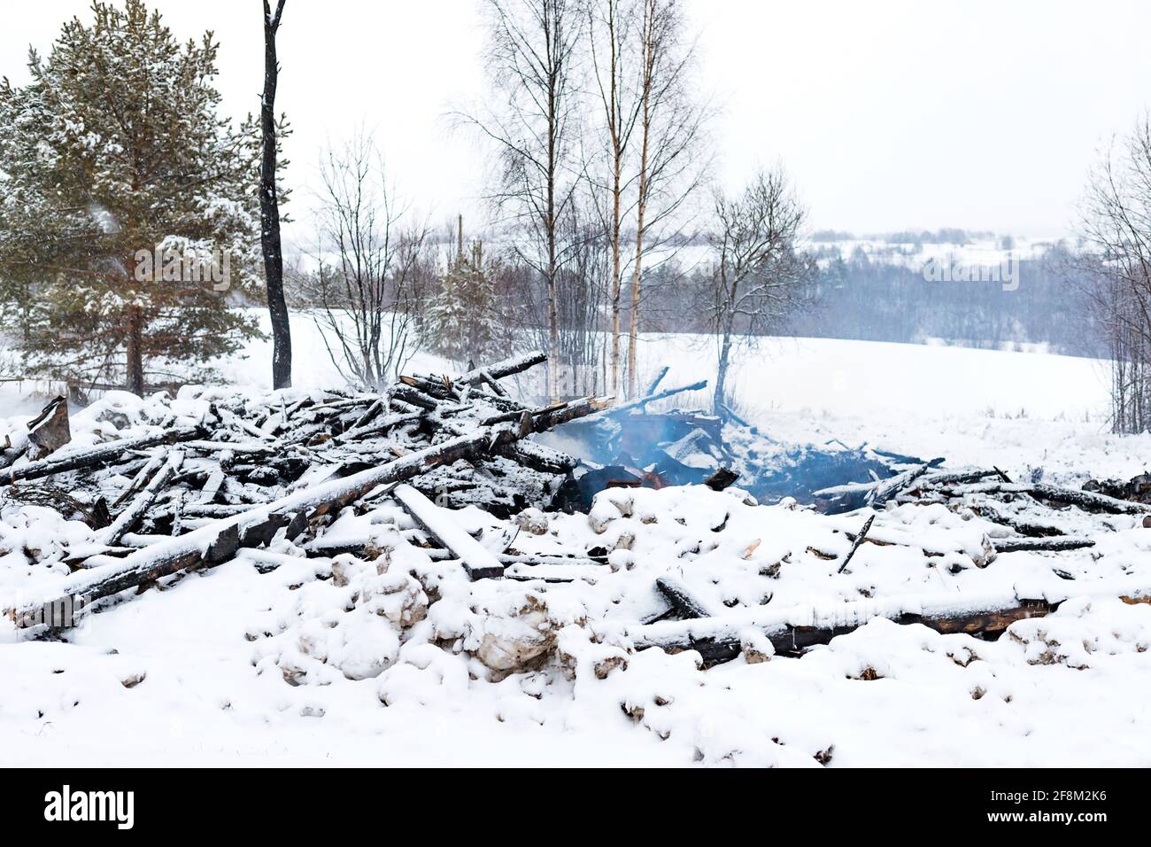Ruins of house burned in fire conflagration on smoke snow winter ...
