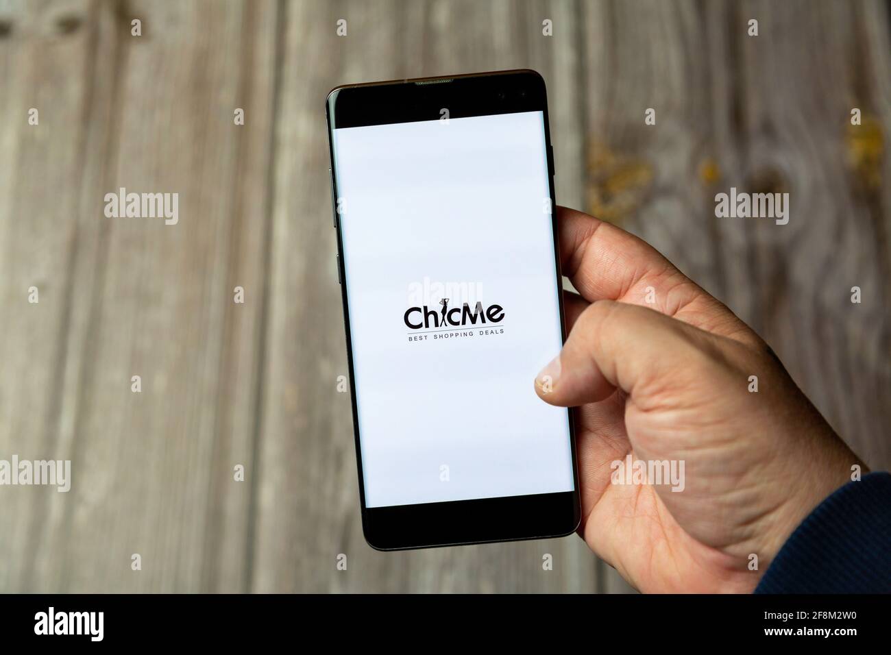 A Mobile phone or Cell phone being held in a hand showing the Chicme ...