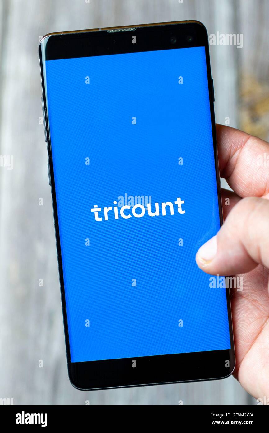 A Mobile phone or Cell phone being held in a hand showing the Tricount ...