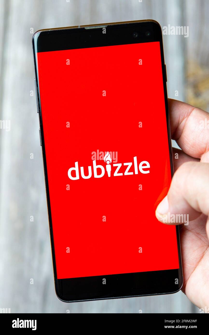 A Mobile phone or Cell phone being held in a hand showing the dubizzle ...