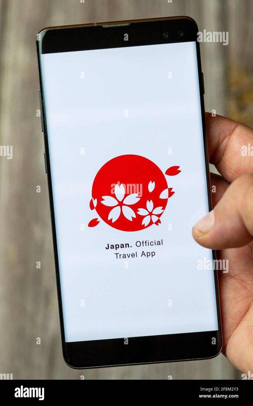 A Mobile phone or Cell phone being held in a hand showing the japan ...