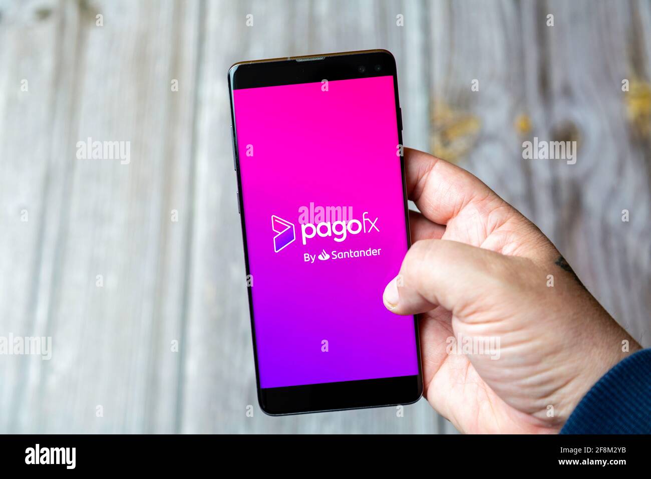 A Mobile phone or Cell phone being held in a hand showing the Pogofx ...