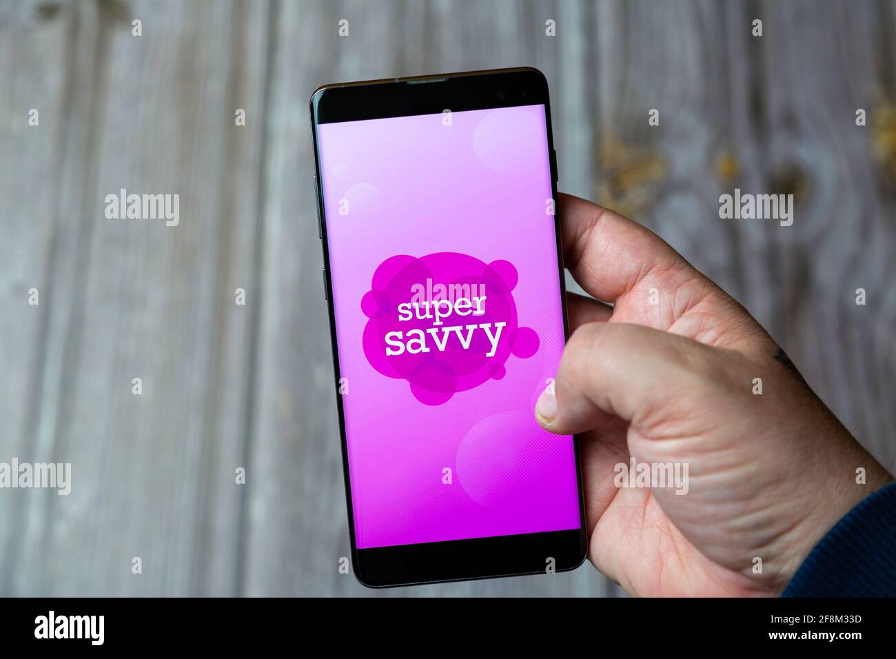 A Mobile phone or Cell phone being held in a hand showing the super ...