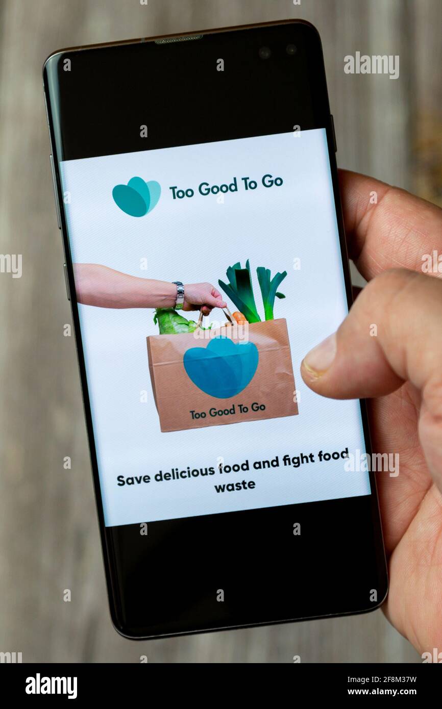 A Mobile phone or Cell phone being held in a hand showing the Too good ...