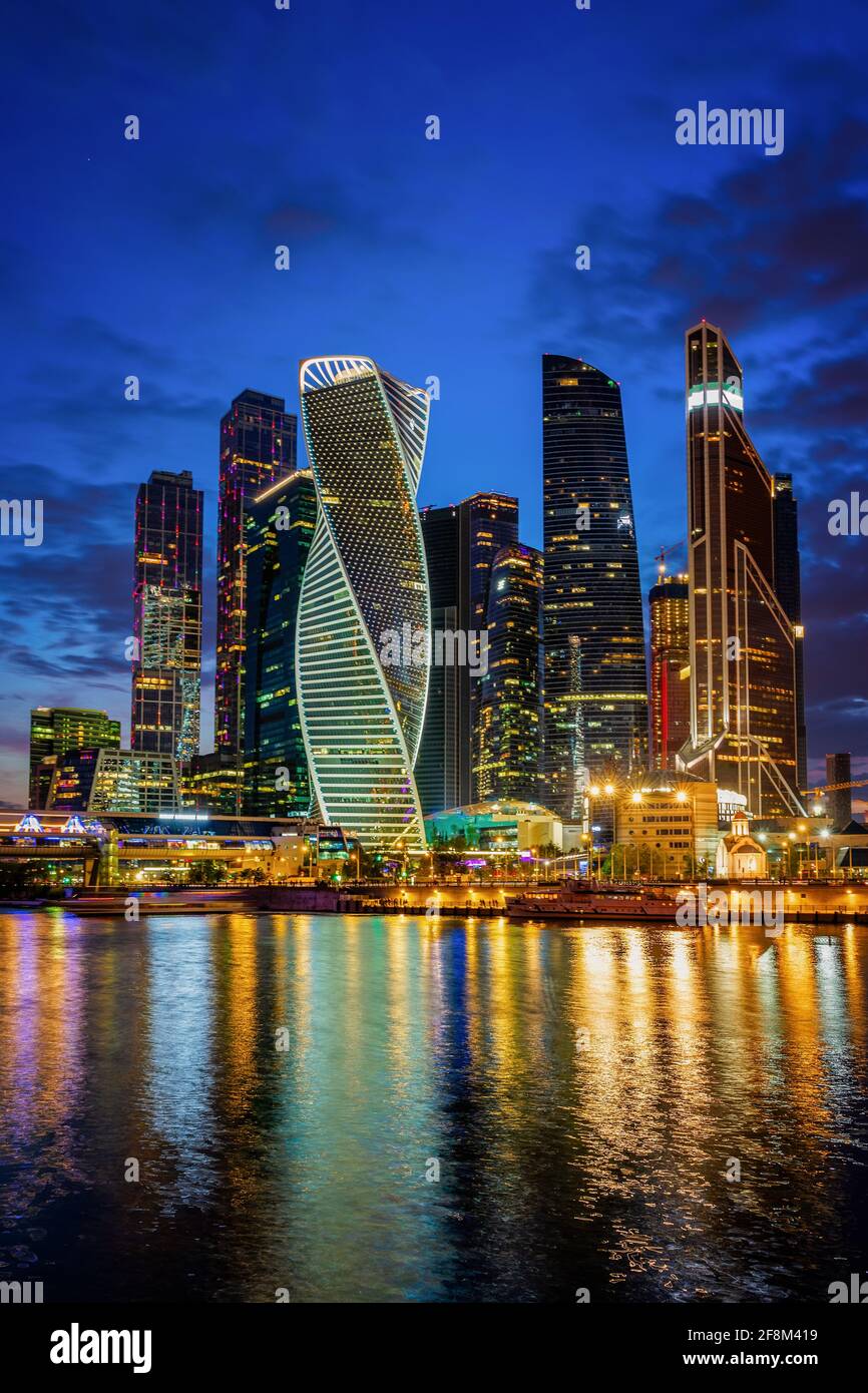 City. Night. Reflection in the water of skyscrapers, bright vivid ...