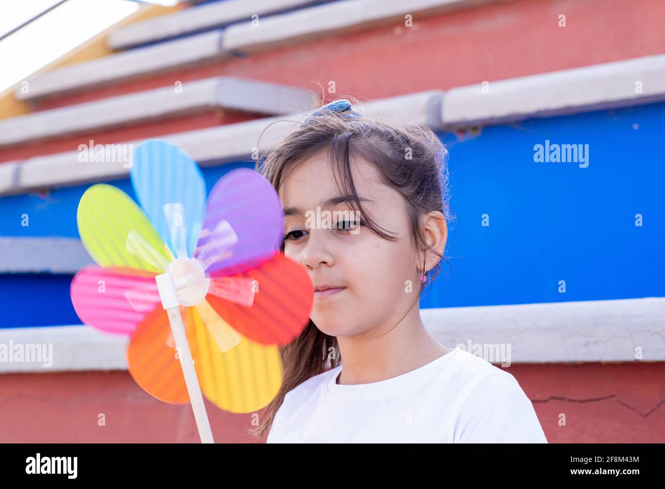 Girl with a pinwheel hi-res stock photography and images - Alamy