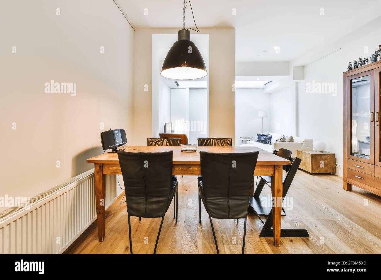 Interior of dining zone in modern studio apartment Stock Photo - Alamy