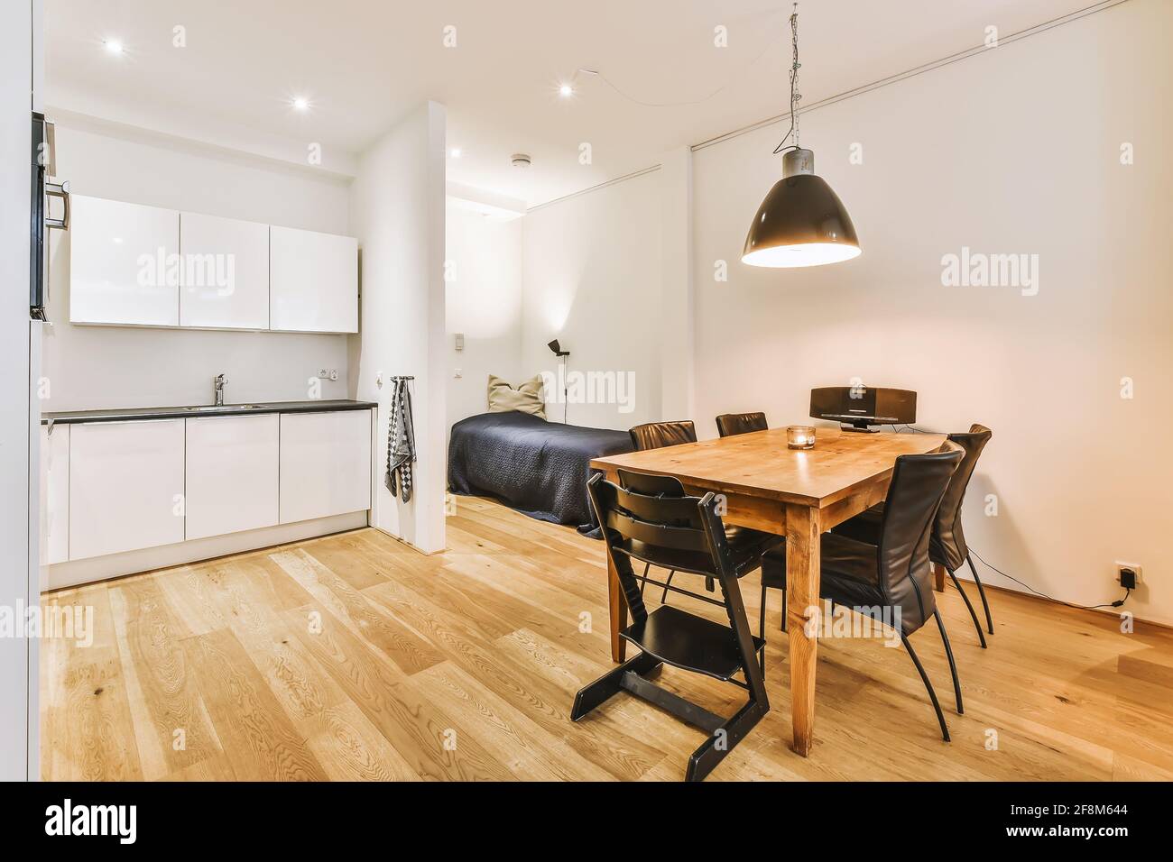 Kitchen and dining zone in studio apartment Stock Photo - Alamy