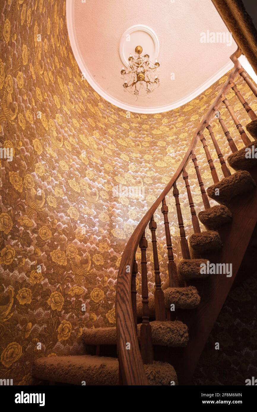 A semi circular staircase inside a house Stock Photo - Alamy