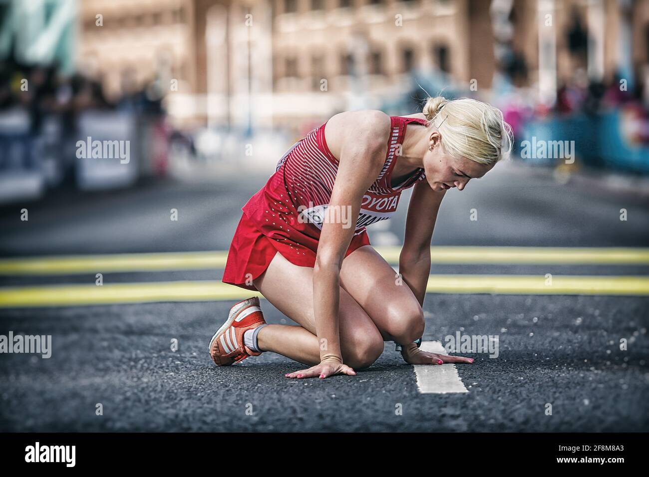 London Runner on the ground exhausted after finishing the London ...