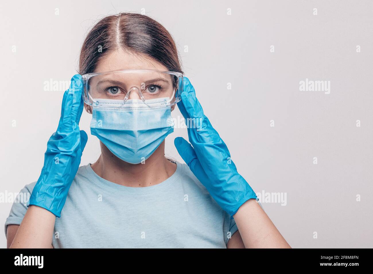 Lab technician - Doctor or nurse wearing and checking protective ...
