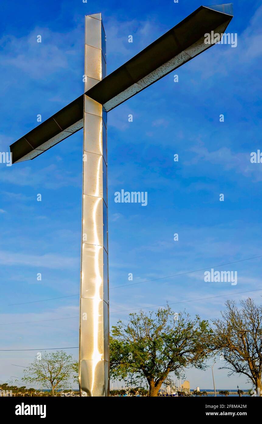 A cross at St. Paul Catholic Church overlooks Highway 90 and Pass ...