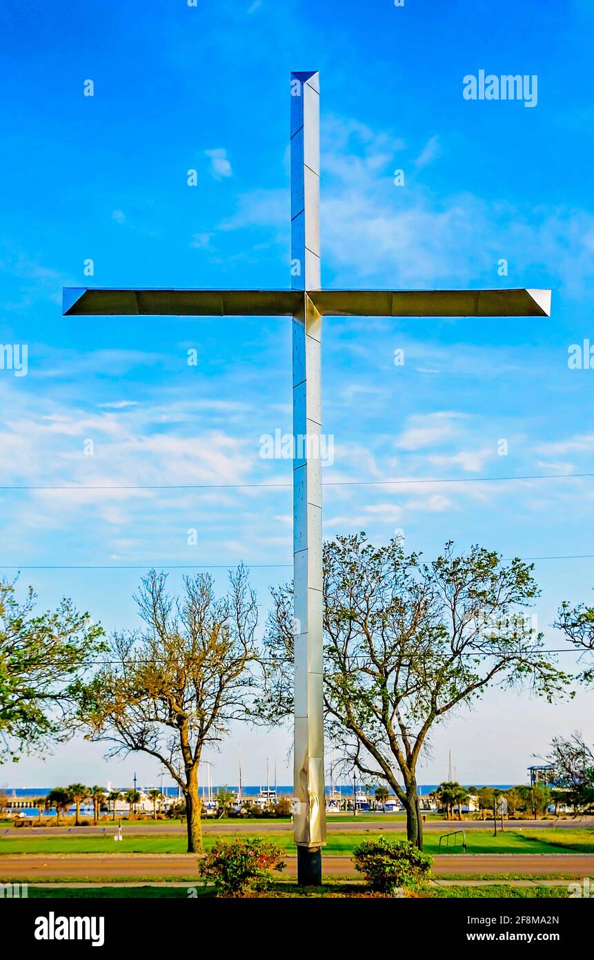 A cross at St. Paul Catholic Church overlooks Highway 90 and Pass ...