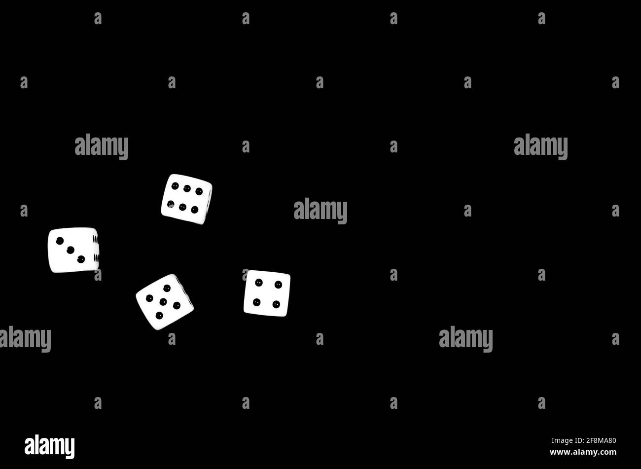 Top view of dice isolated on a black background with space for text ...