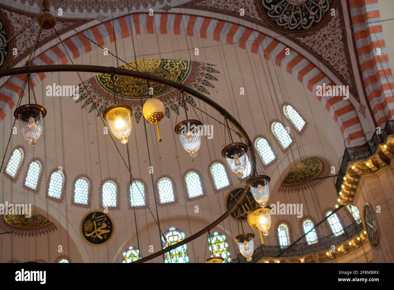 Bright Lamps on circular chandelier in a big mosque Stock Photo - Alamy