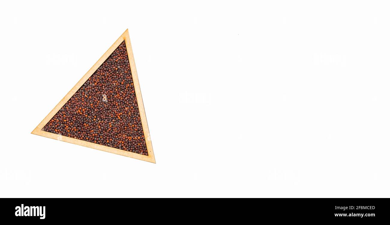 Brown Indian seeds in the triangular bowl - Healthy food Stock Photo ...