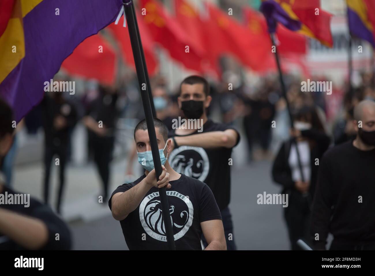 A young man holding a Republican flag as they parade during the second ...