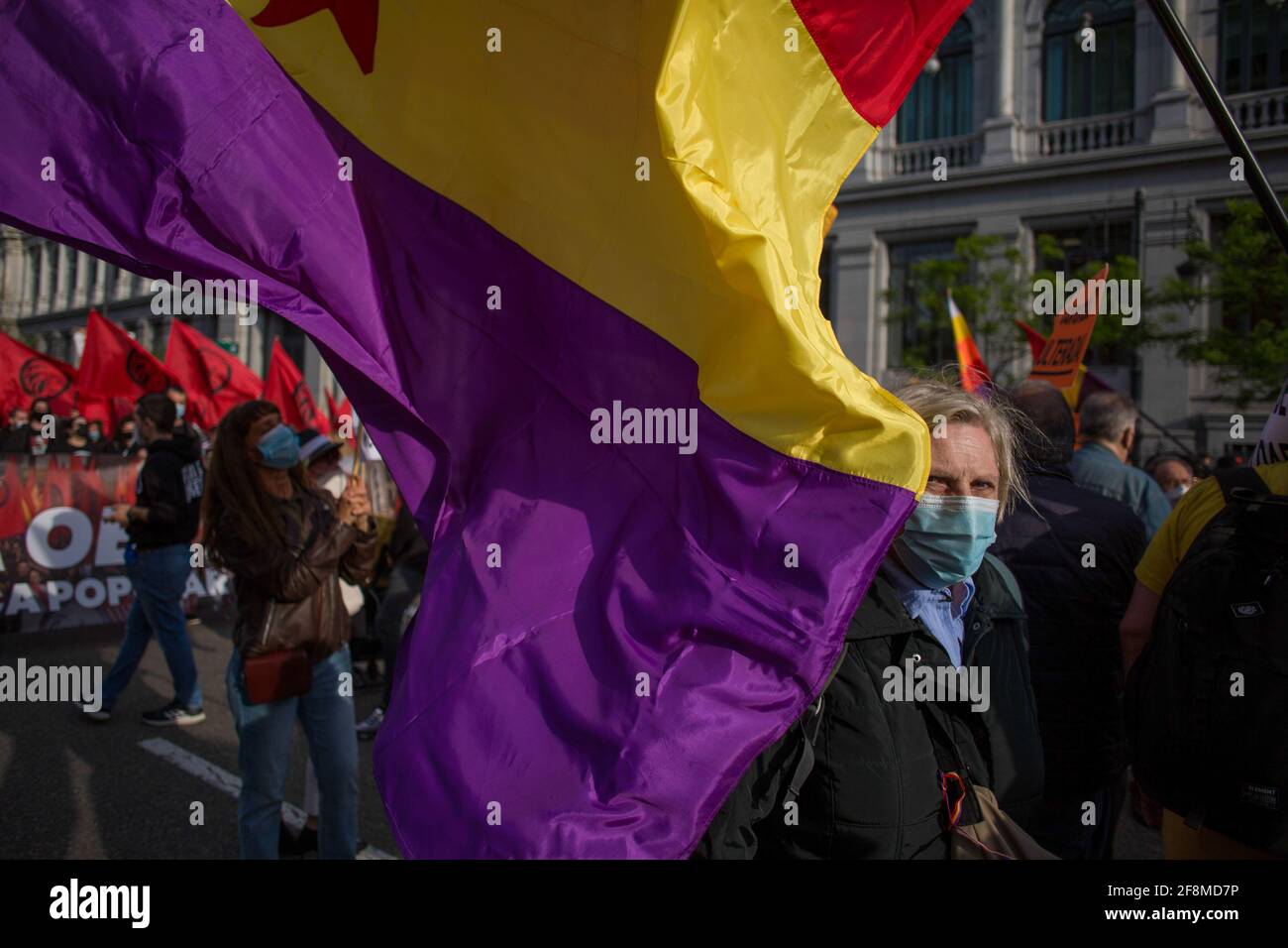 Madrid, Spain. 14th Apr, 2021. A woman seen next to a giant Republican ...