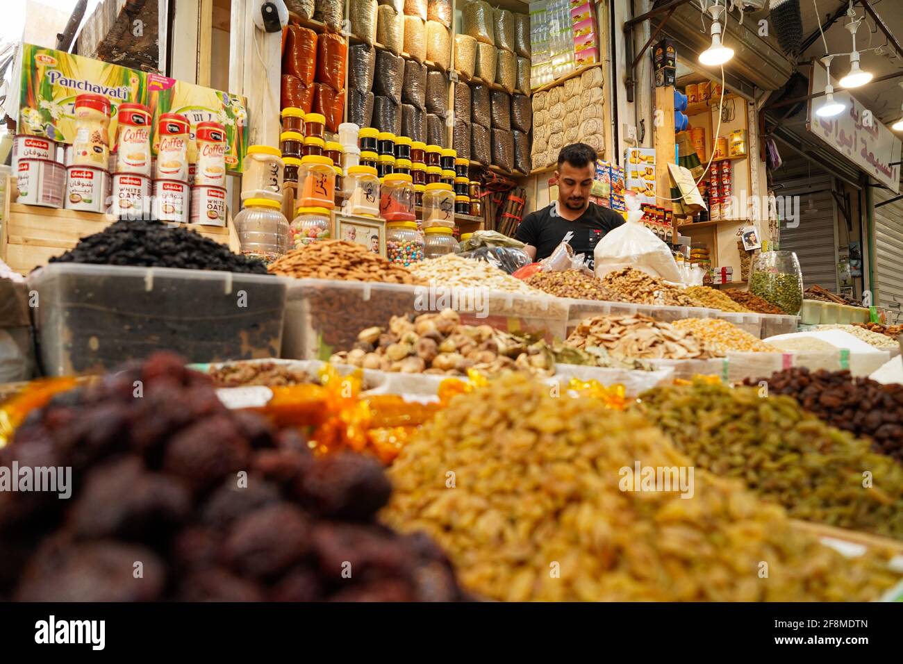 A spices seller seen sitting in his shop in Bab Al-Saray market during ...