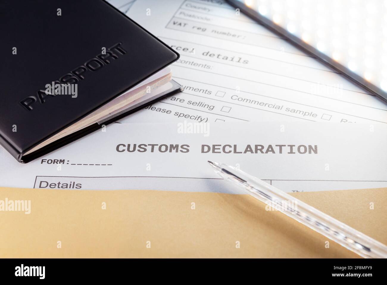 a Passport over Customs Declaration form. customs Agent concept ...