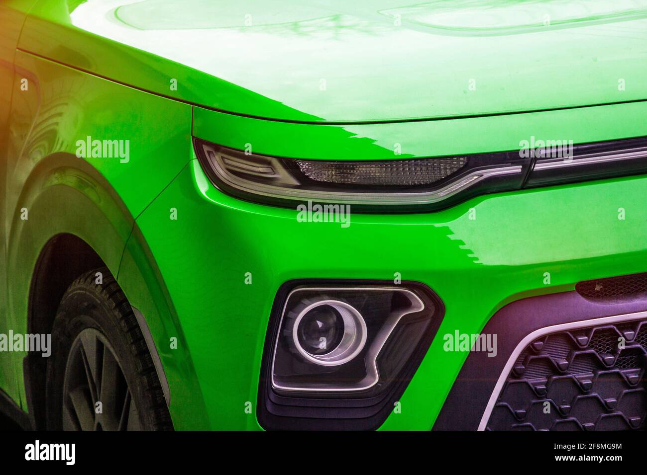 green electro car on the street of the city detailing lights Stock ...