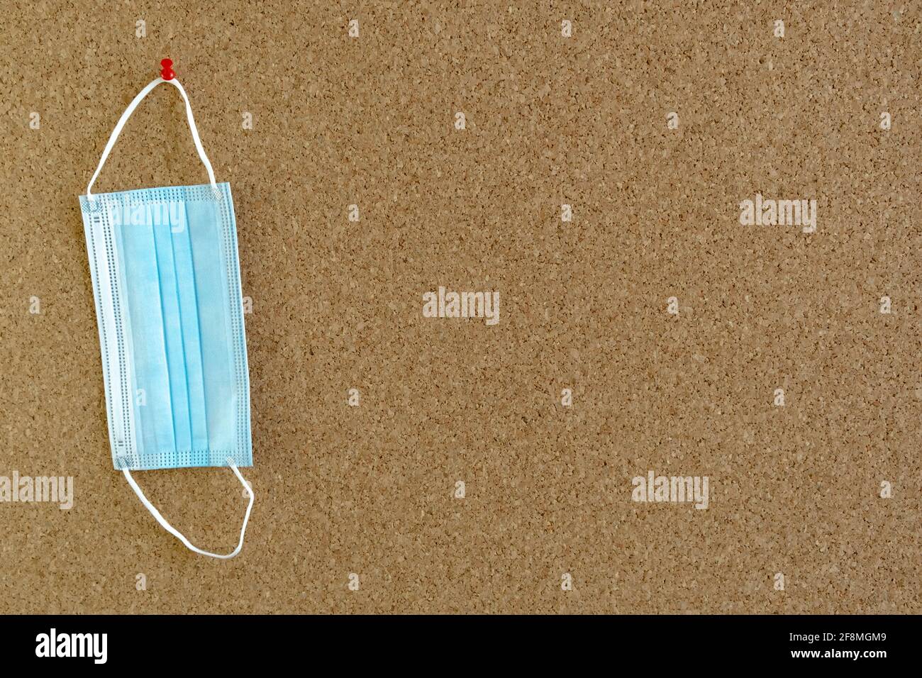 Cork board with pinned fase medical mask office concept, protection ...