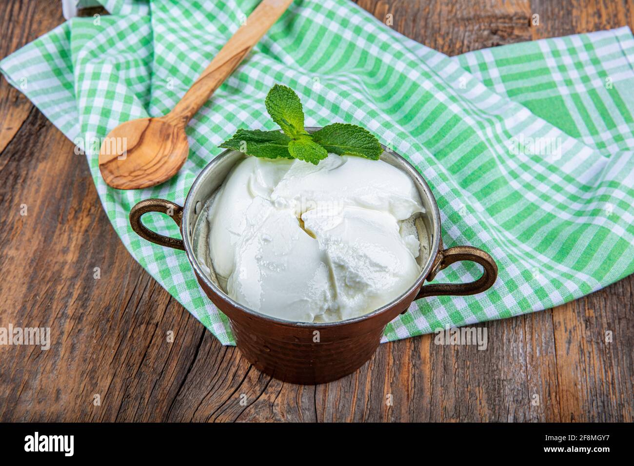 Water buffalo yogurt fermented in copper bowl. Homemade Yogurt in bowl ...