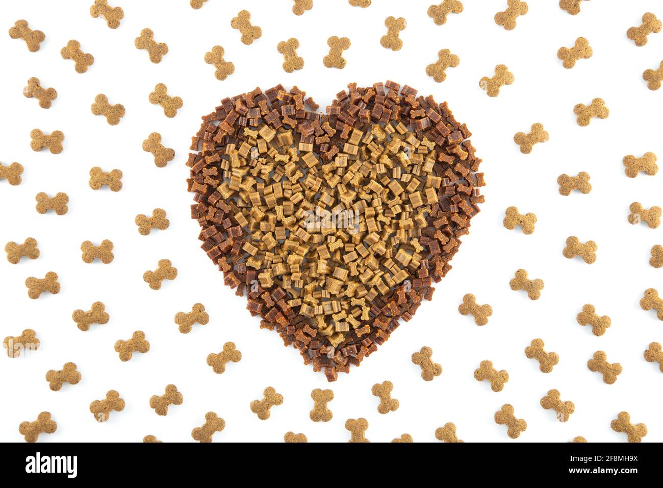 Dried animal pet dog food in heart form isolated on white background ...