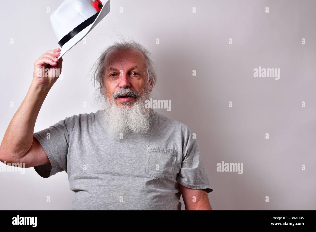 Old American male saluting with his white fedora Stock Photo - Alamy