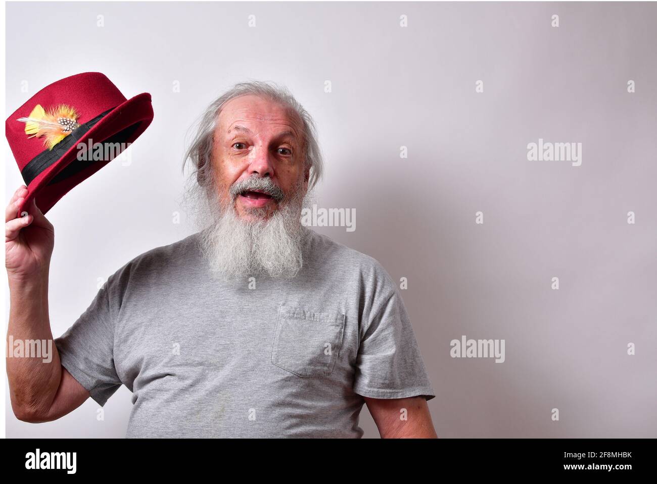 Old American male saluting with his red fedora.Mature gentleman salutes ...
