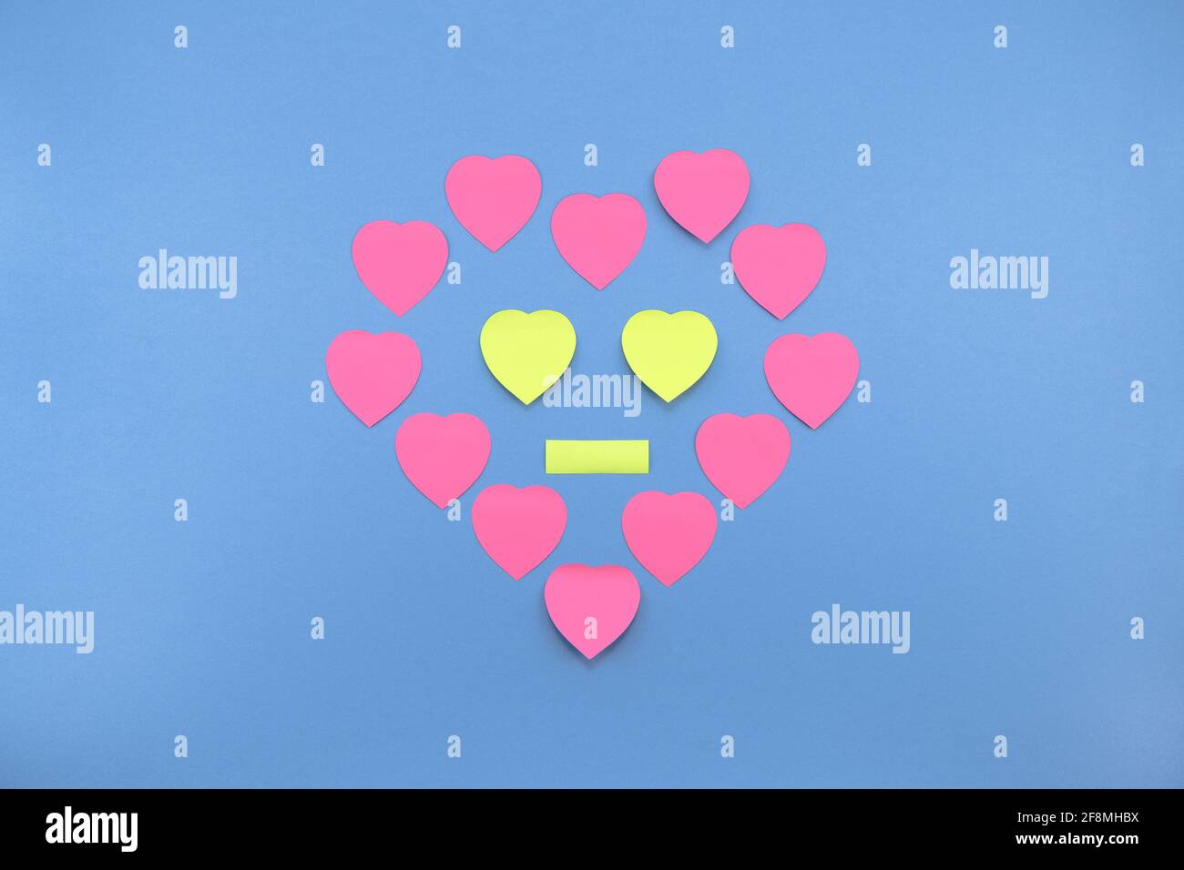 Smile face from Neon sticky notes in heart form shape. Love in ...