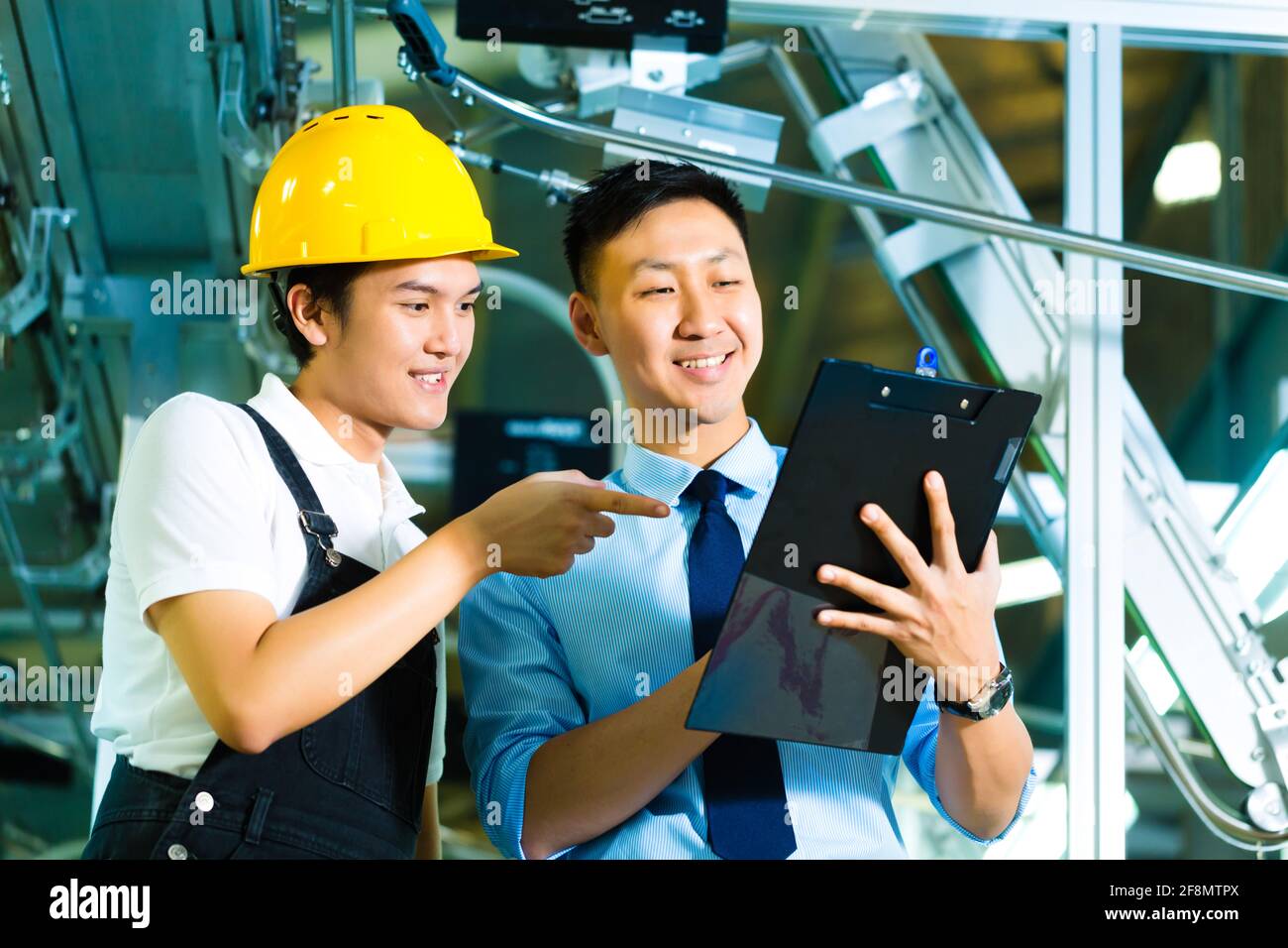 Worker or production manager and owner, ceo or controller, look on a ...