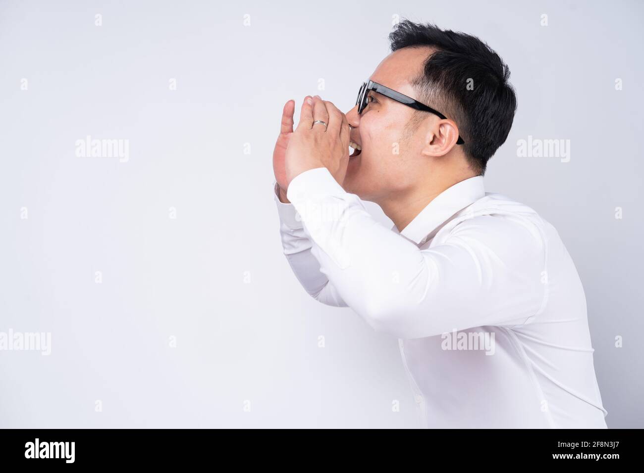 Excited young chinese people shouting hi-res stock photography and ...