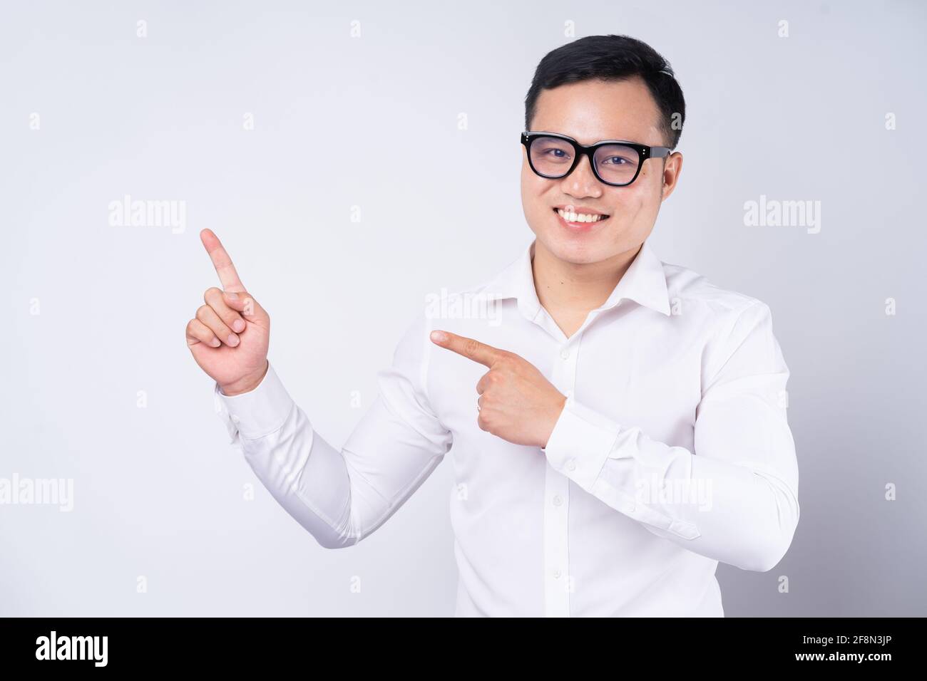 Positive korean male pointing finger hi-res stock photography and ...