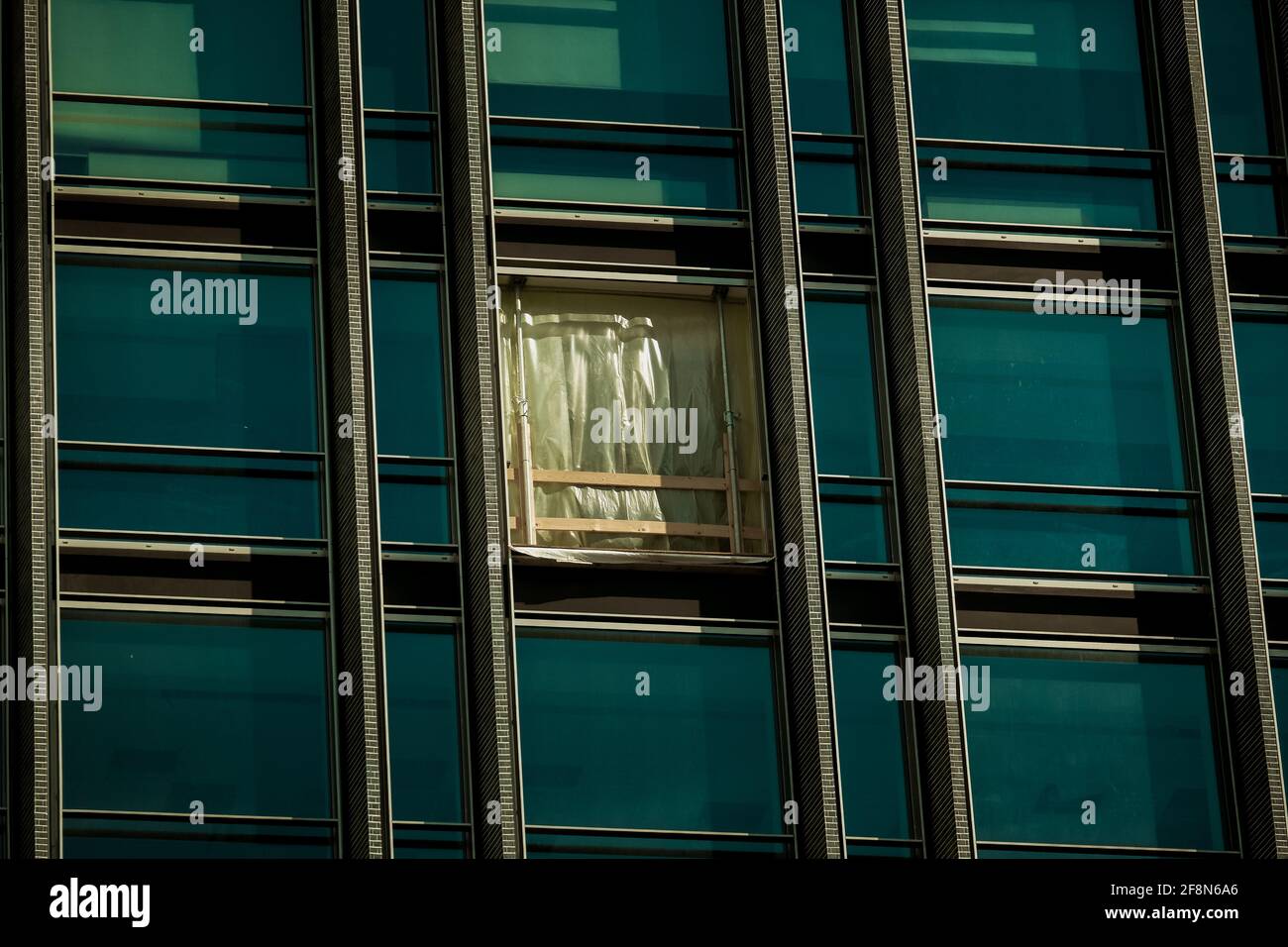 Building facade with windows and sunlight falling on it Stock Photo - Alamy