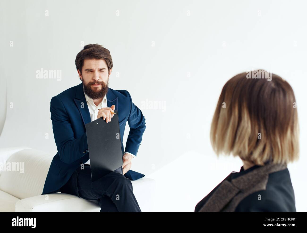 Business man and woman in suit on a light background recruiting ...