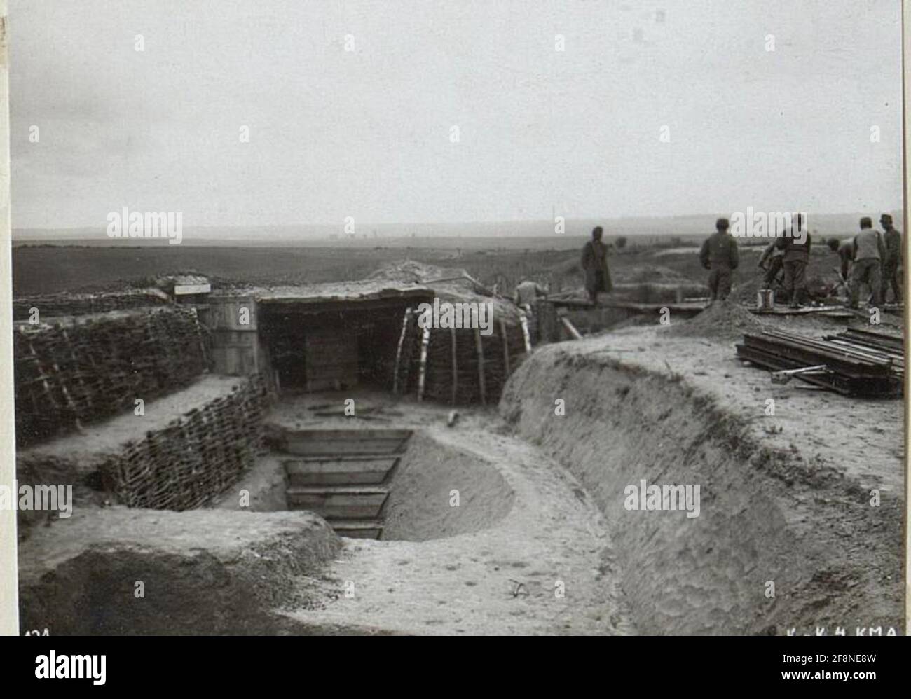 Fuchs hole, machine gun, observation stand. Husars work on a cemented m ...