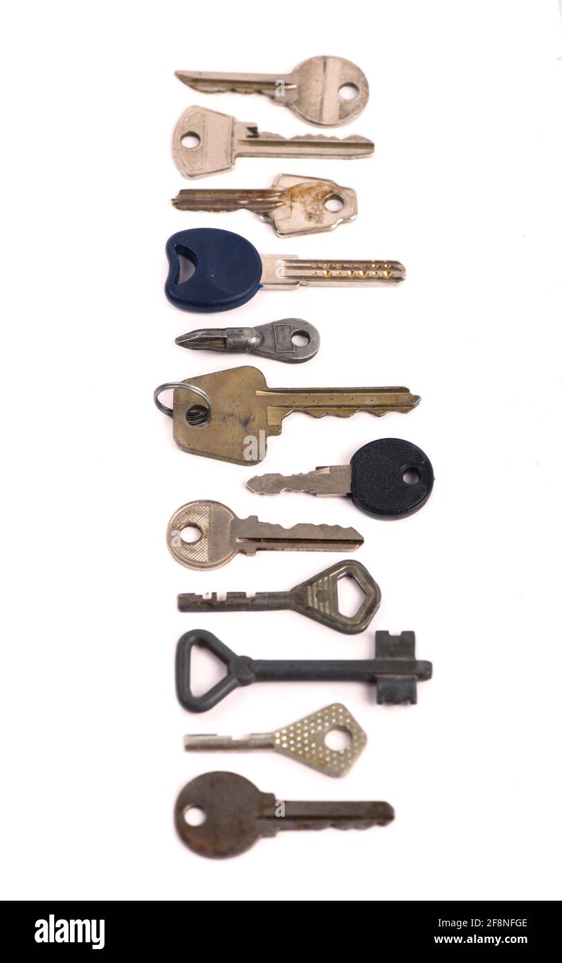 overhead of many different keys in oder on wooden background concept ...