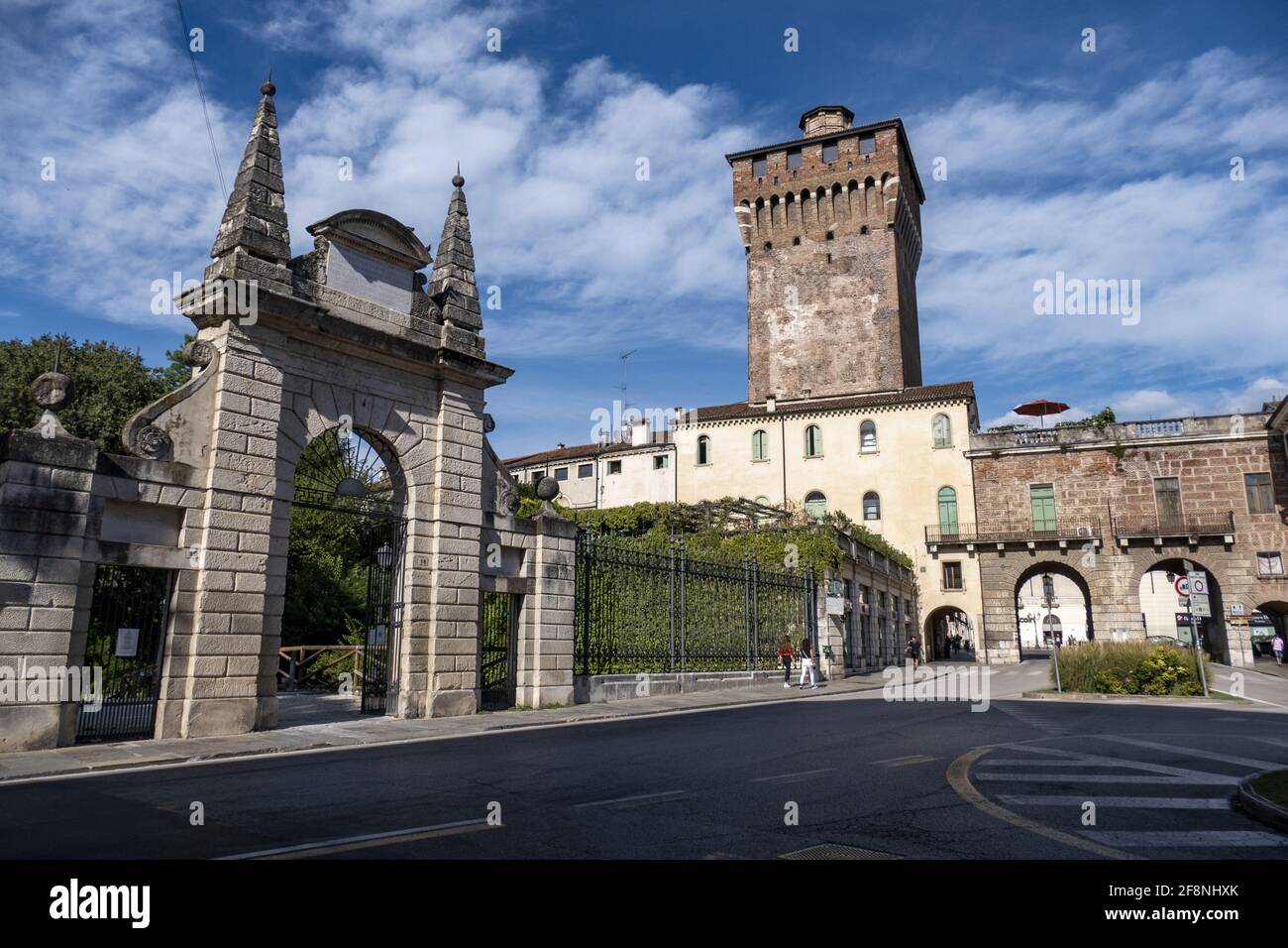 Beautiful tower of Porta Castello with a park and buildings under a ...
