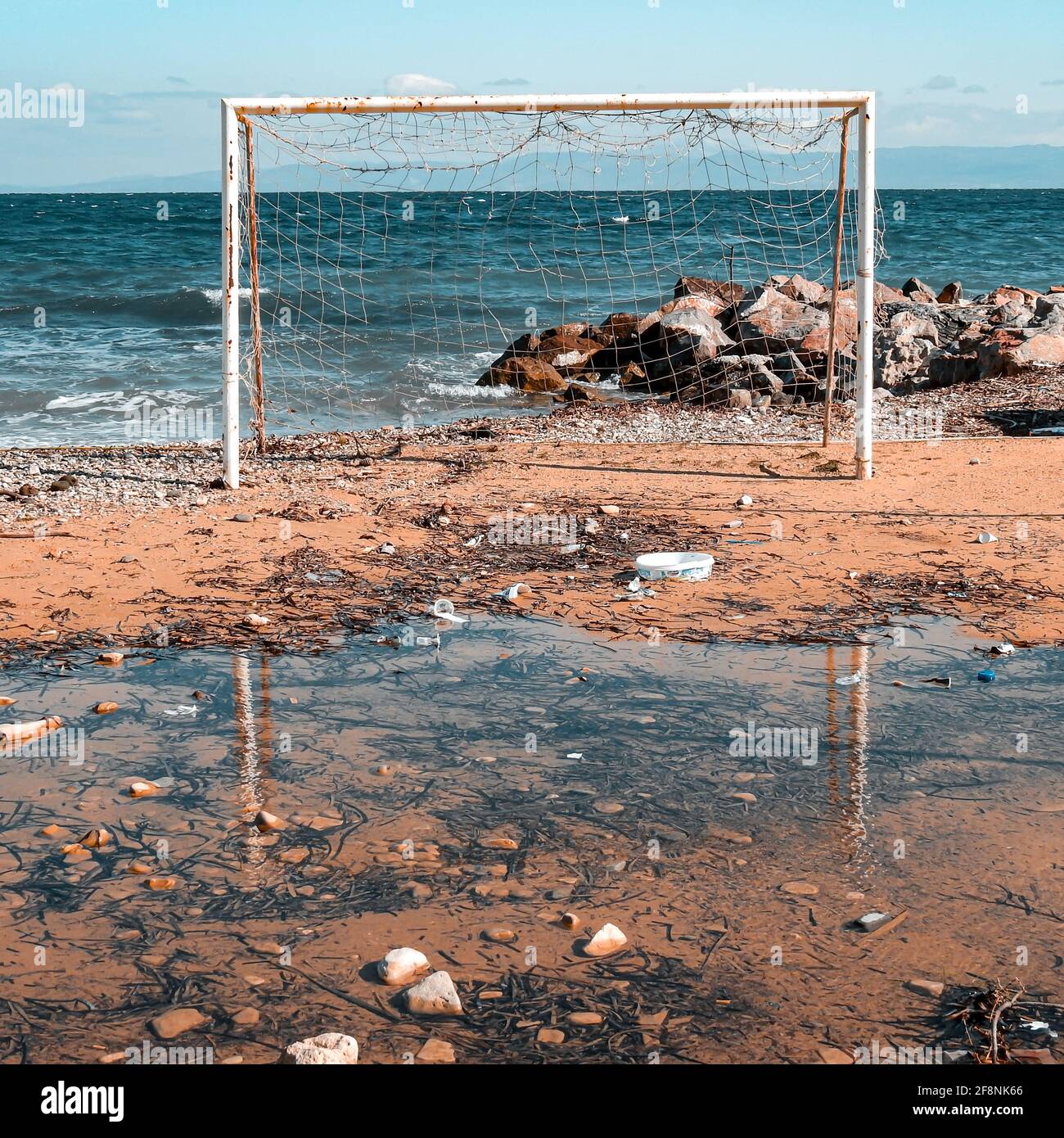 Vertical shot of a football goal poster on the sea background Stock ...