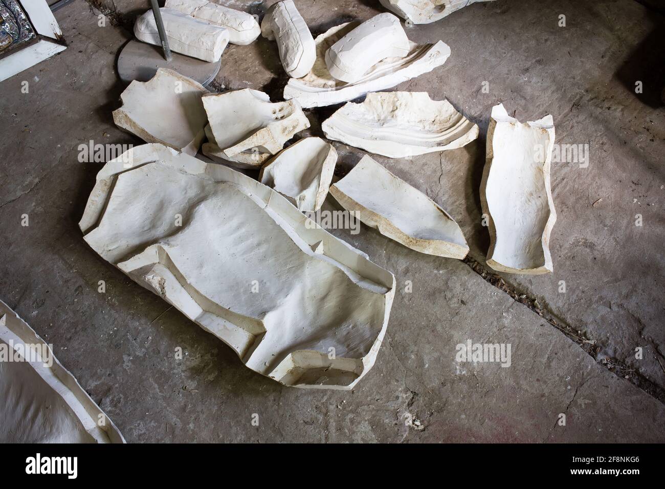Broken plaster blanks for sculpture on the floor of workshop Stock ...
