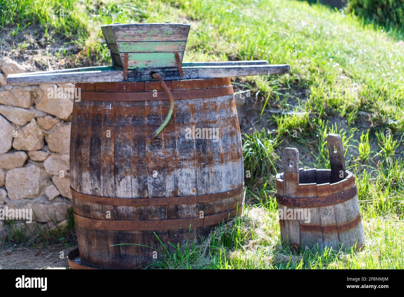 Old rusty wine press with oak barrel at the backyard Stock Photo - Alamy