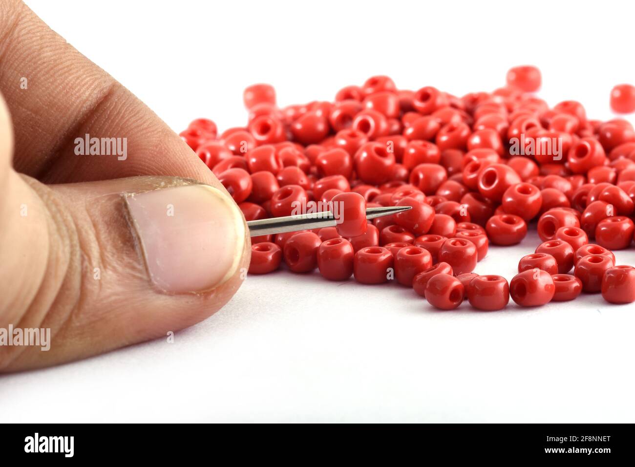 Beads in hand hi-res stock photography and images - Alamy