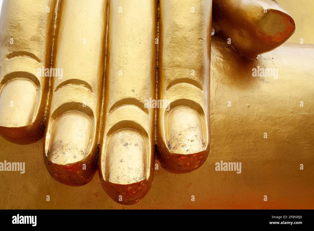 A close up view of the fingers of the famous Big Buddha statue in ...