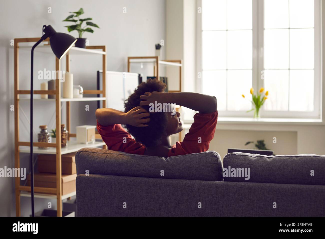 Relaxed young black woman hi-res stock photography and images - Alamy